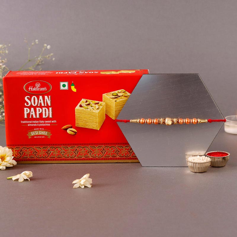 Send Sneh Rose Gold Rakhi & Soan Papdi Online - RKH22-107178 | Giftalove